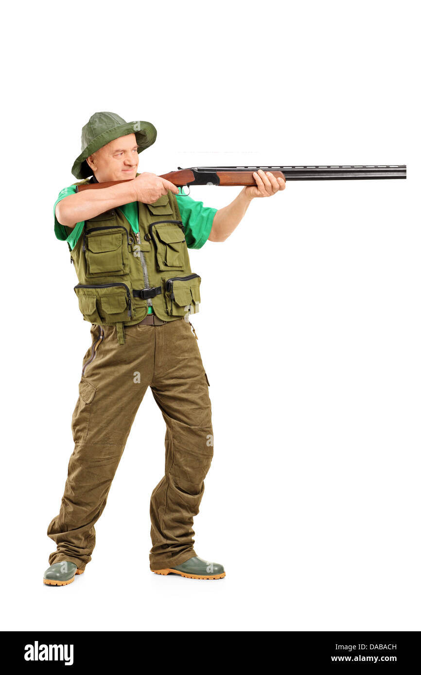 Full length portrait of a male hunter shooting with a rifle Stock Photo ...