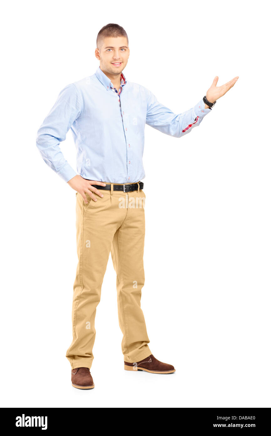 Full length portrait of a young handsome guy gesturing with his hand ...