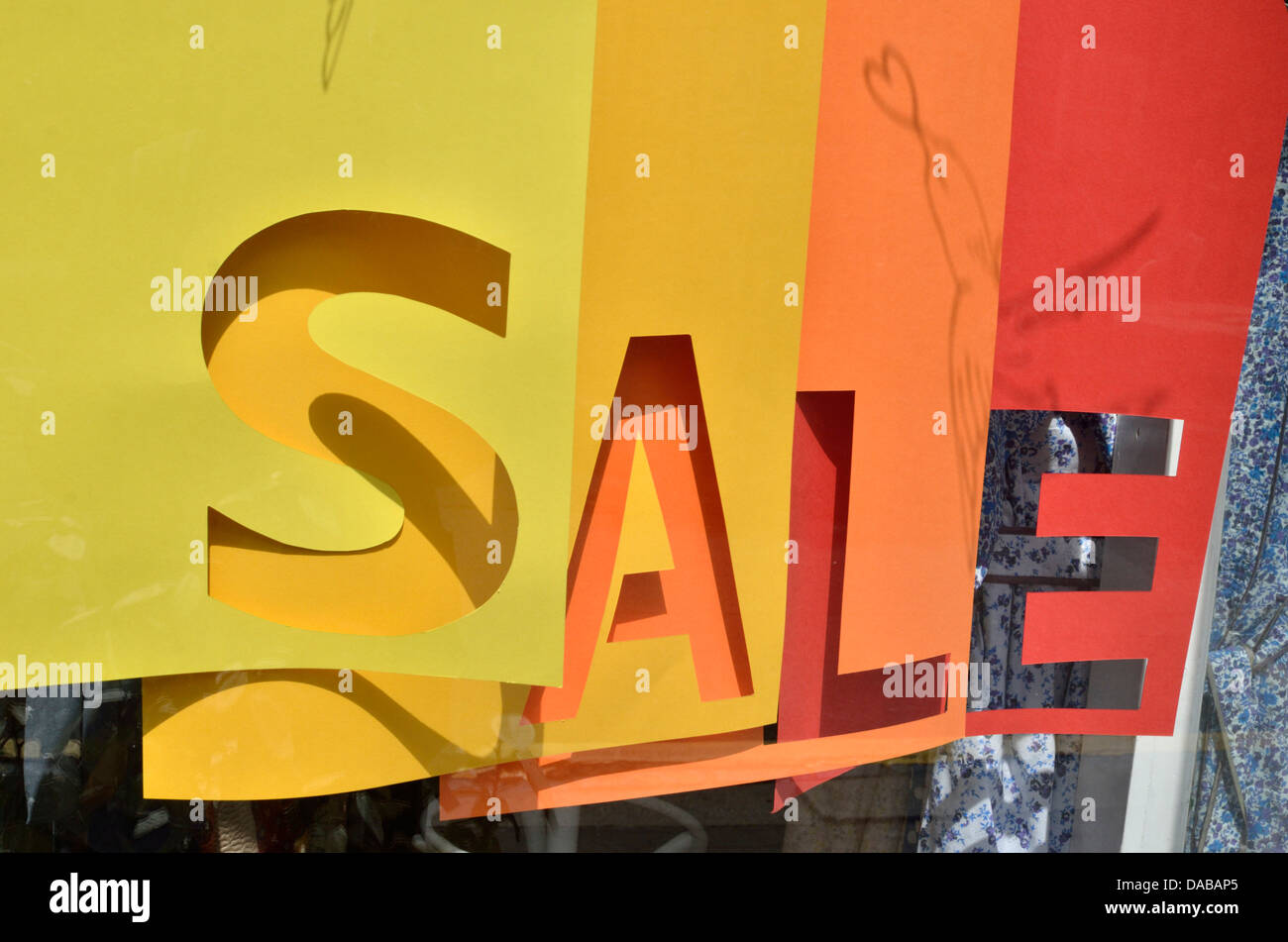 Bright colourful 'Sale' sign in a shop window Stock Photo - Alamy