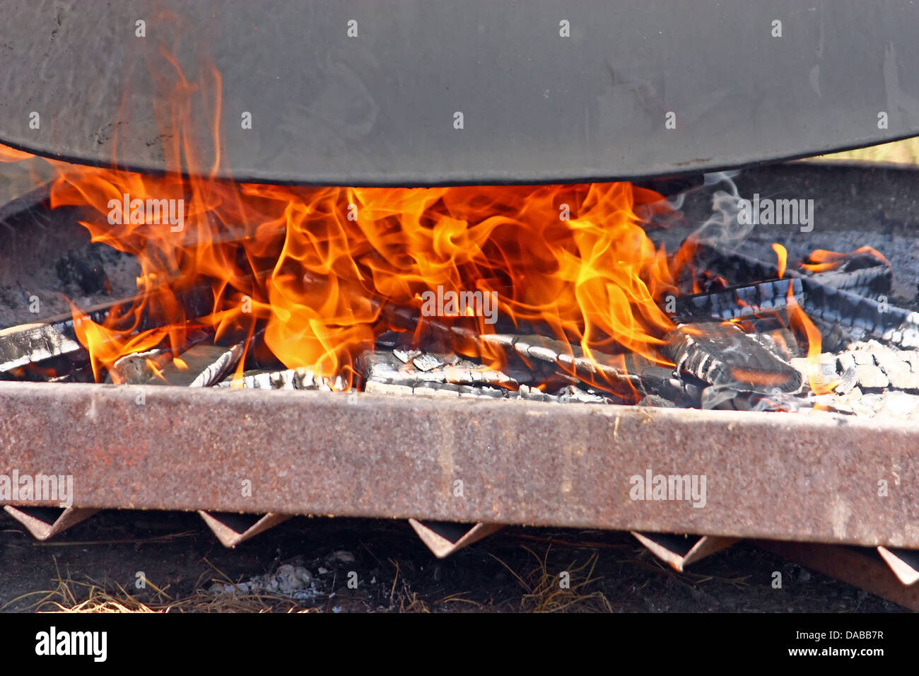 Open fireplace full of fire wood and fire Stock Photo - Alamy
