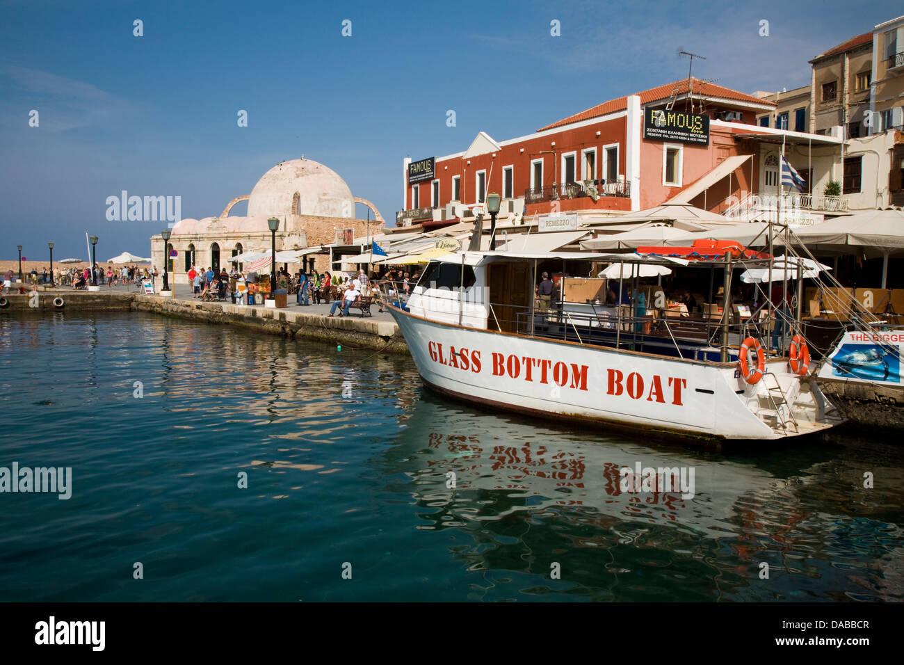 A broad promenade lined with tourist shops and cafes circles the lovely ...