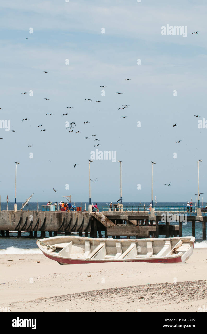 Fishing boat on beach and pier in Los Organos Beach near Mancora, Peru ...