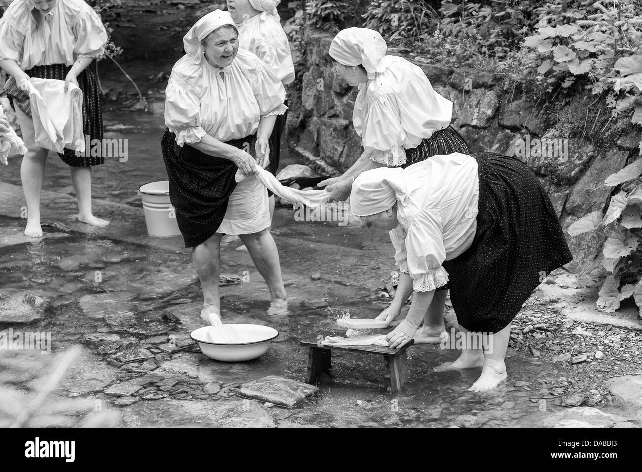 Women hand washing in stream hi-res stock photography and images - Alamy