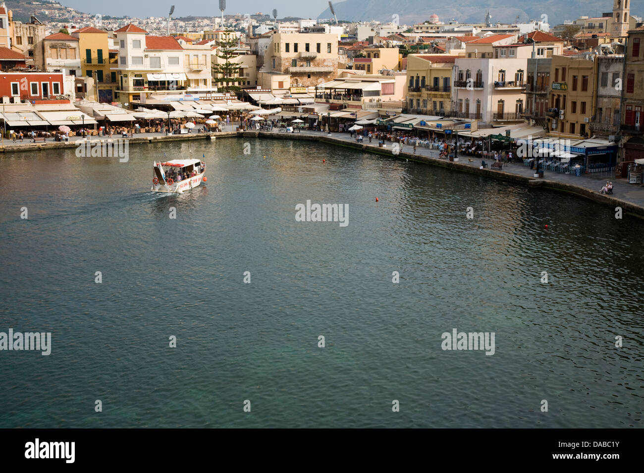 A broad promenade lined with tourist shops and cafes circles the lovely ...