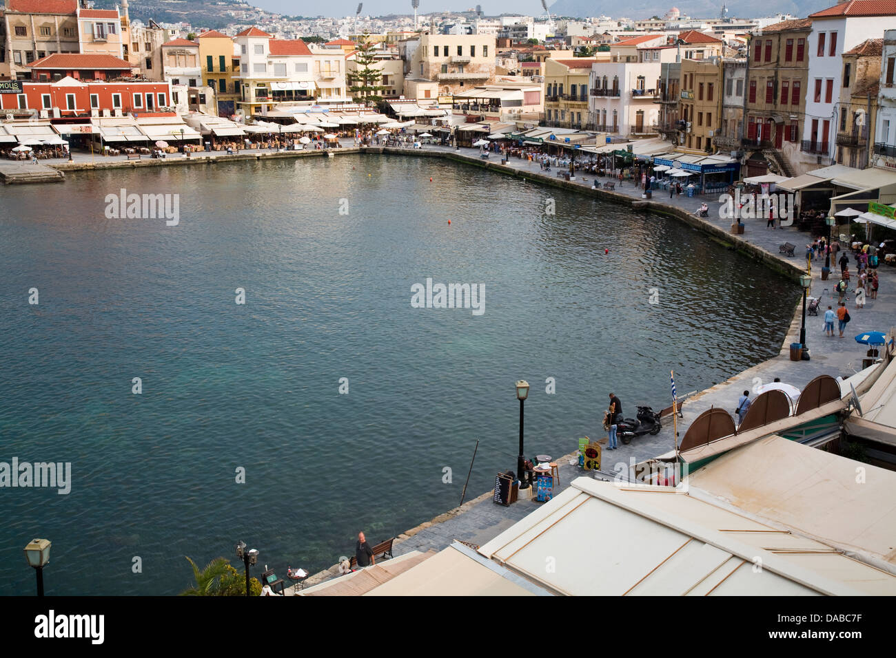 A broad promenade lined with tourist shops and cafes circles the lovely ...