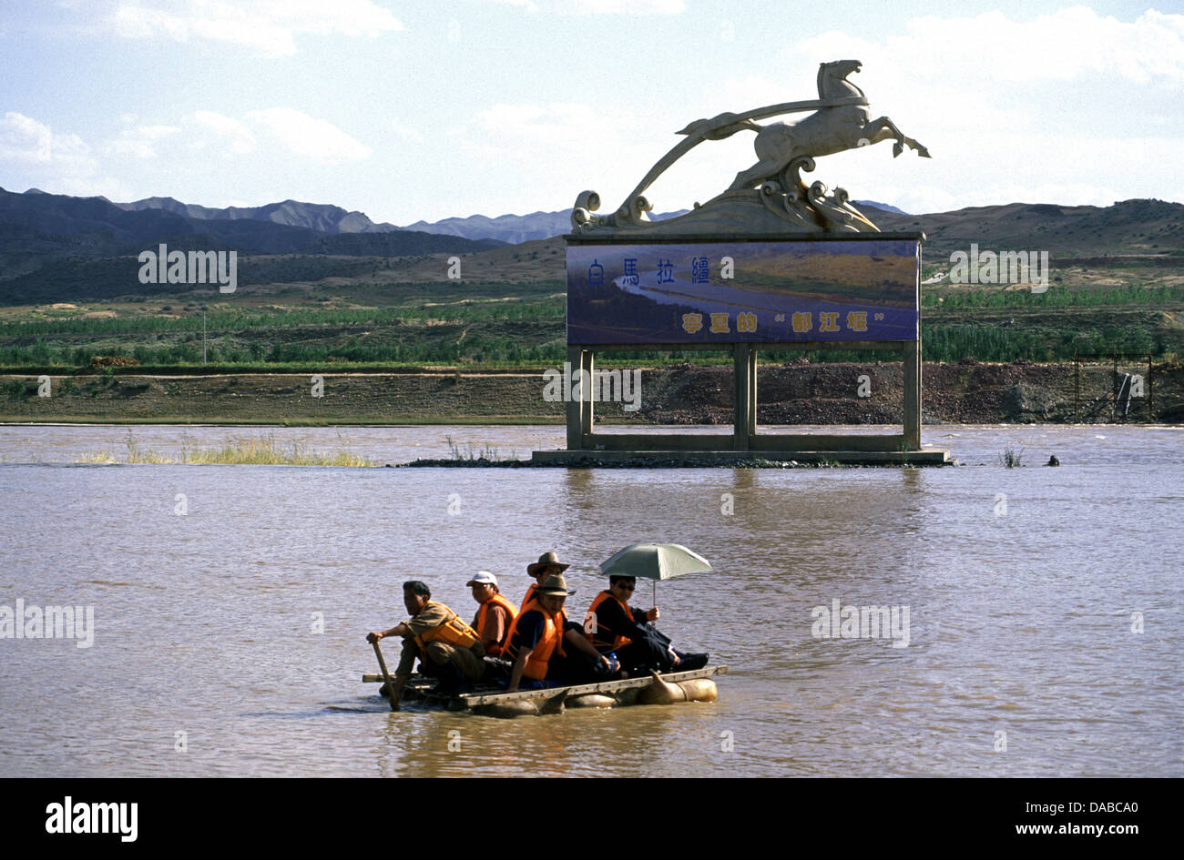 Chinese men rowing in a raft made from inflated sheepskin lashed to a ...