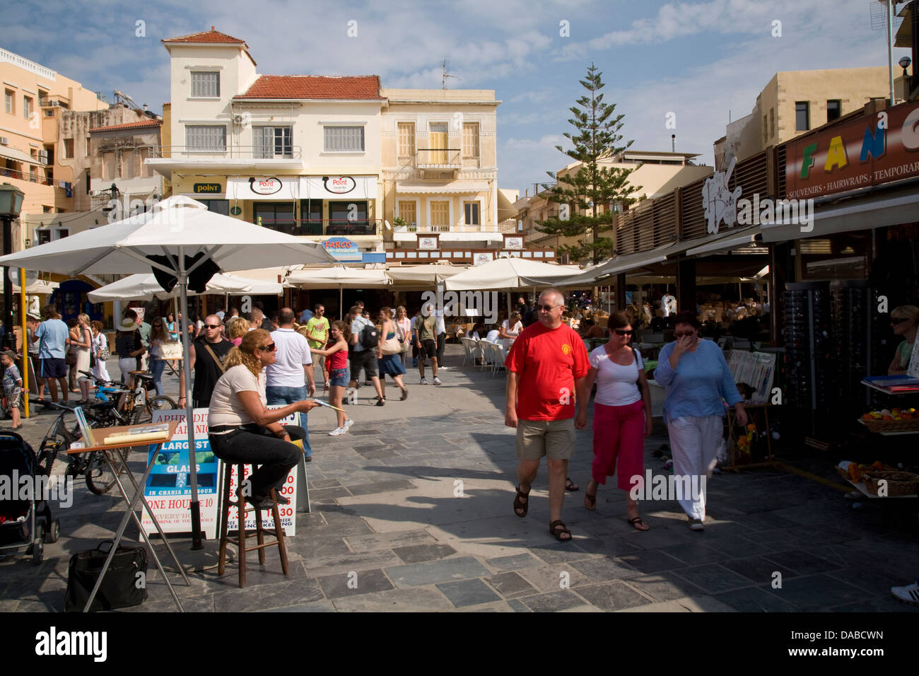 A broad promenade lined with tourist shops and cafes circles the lovely ...