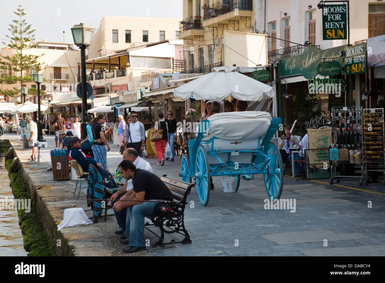 A broad promenade lined with tourist shops and cafes circles the lovely ...