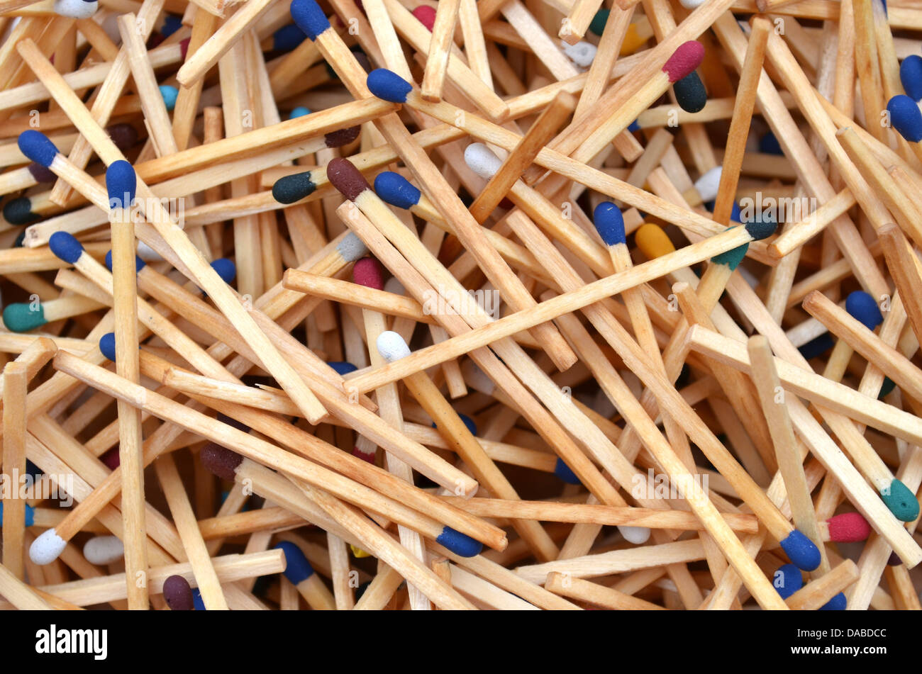 Wooden matches with different colors background Stock Photo - Alamy