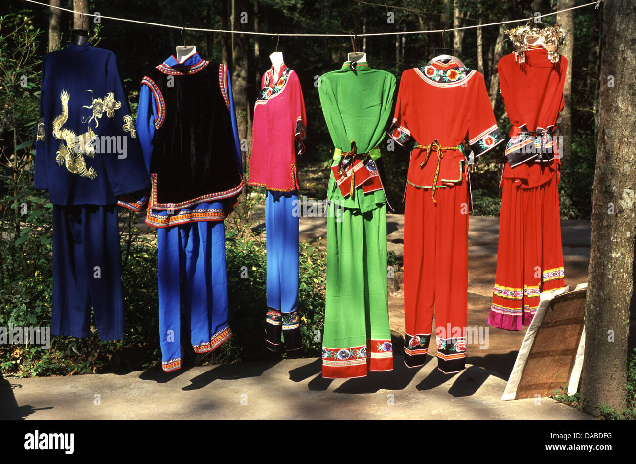 Traditional clothing hanging in a stall Hunan province China Stock ...