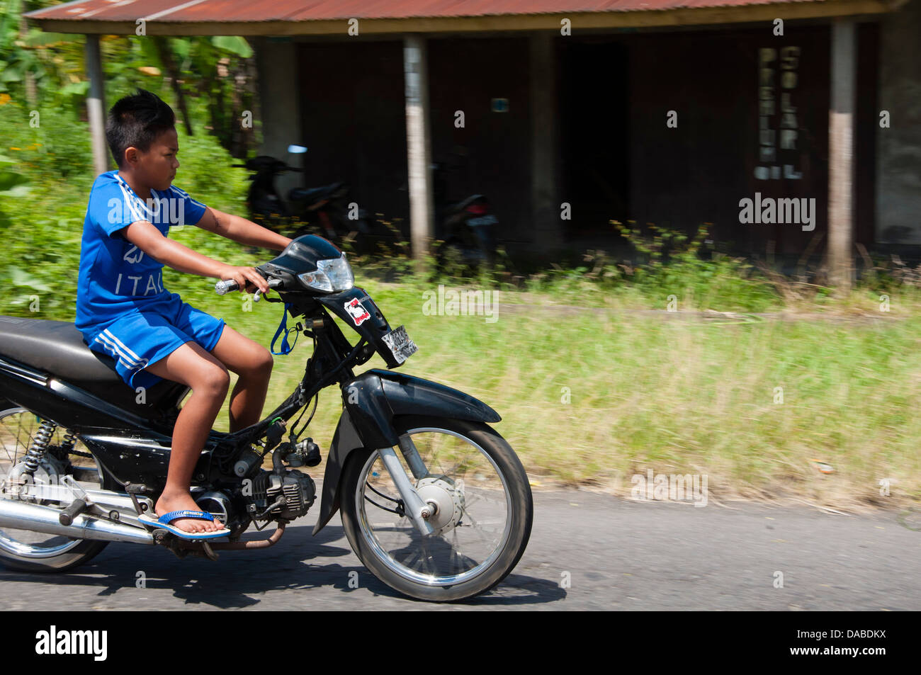 Boy riding a bike Stock Photo - Alamy