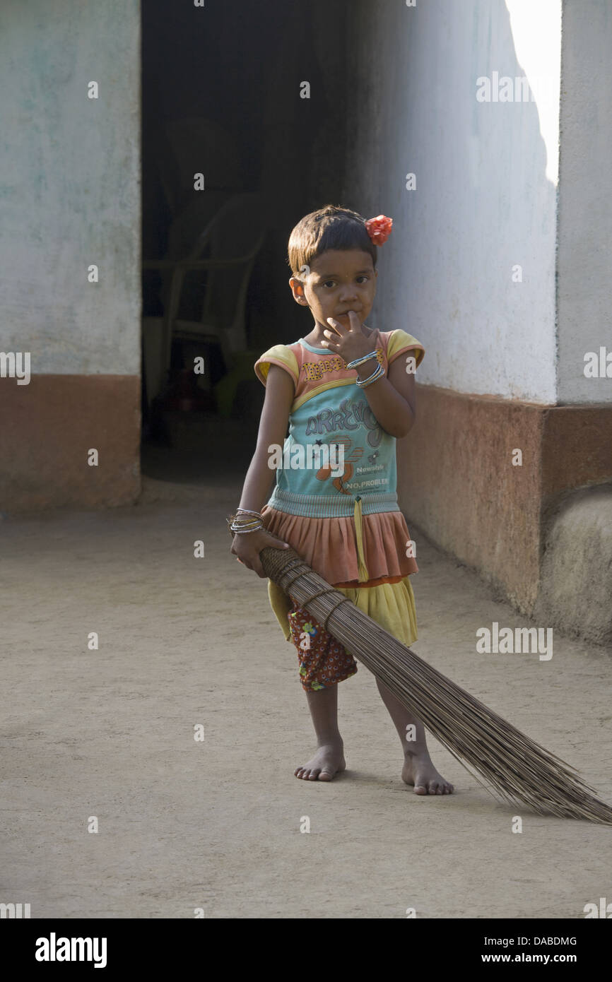 Child playing with broom Stock Photo - Alamy
