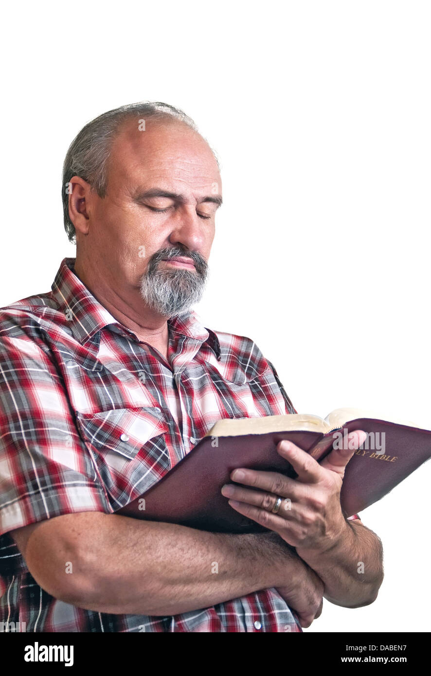 Adult male reading a Christian Bible Stock Photo - Alamy