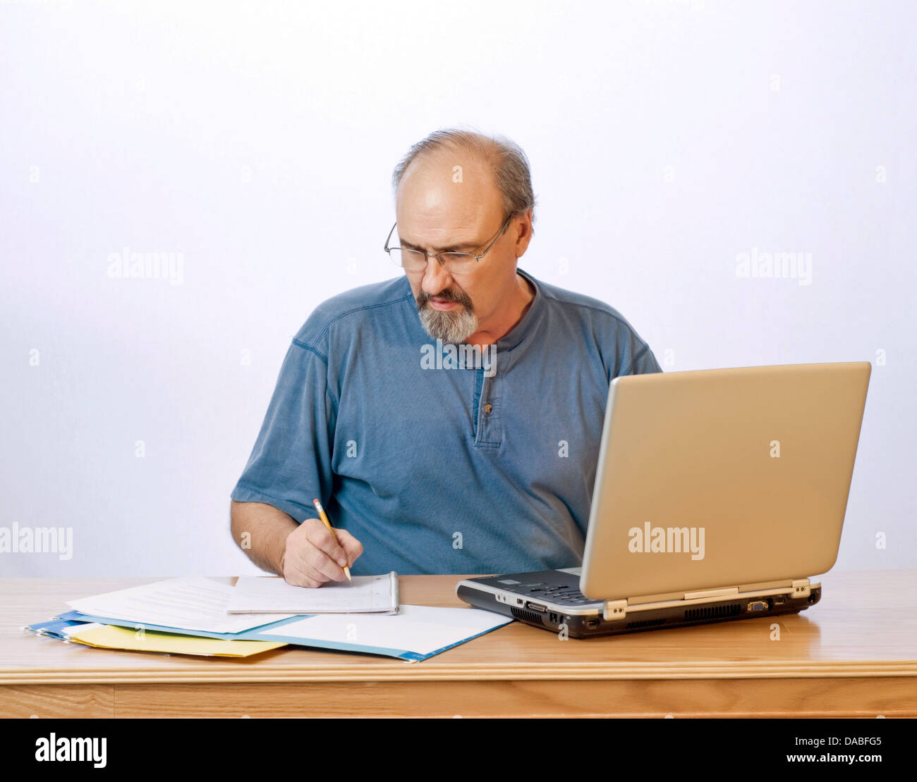 Businessman writing notes desk laptop hi-res stock photography and ...