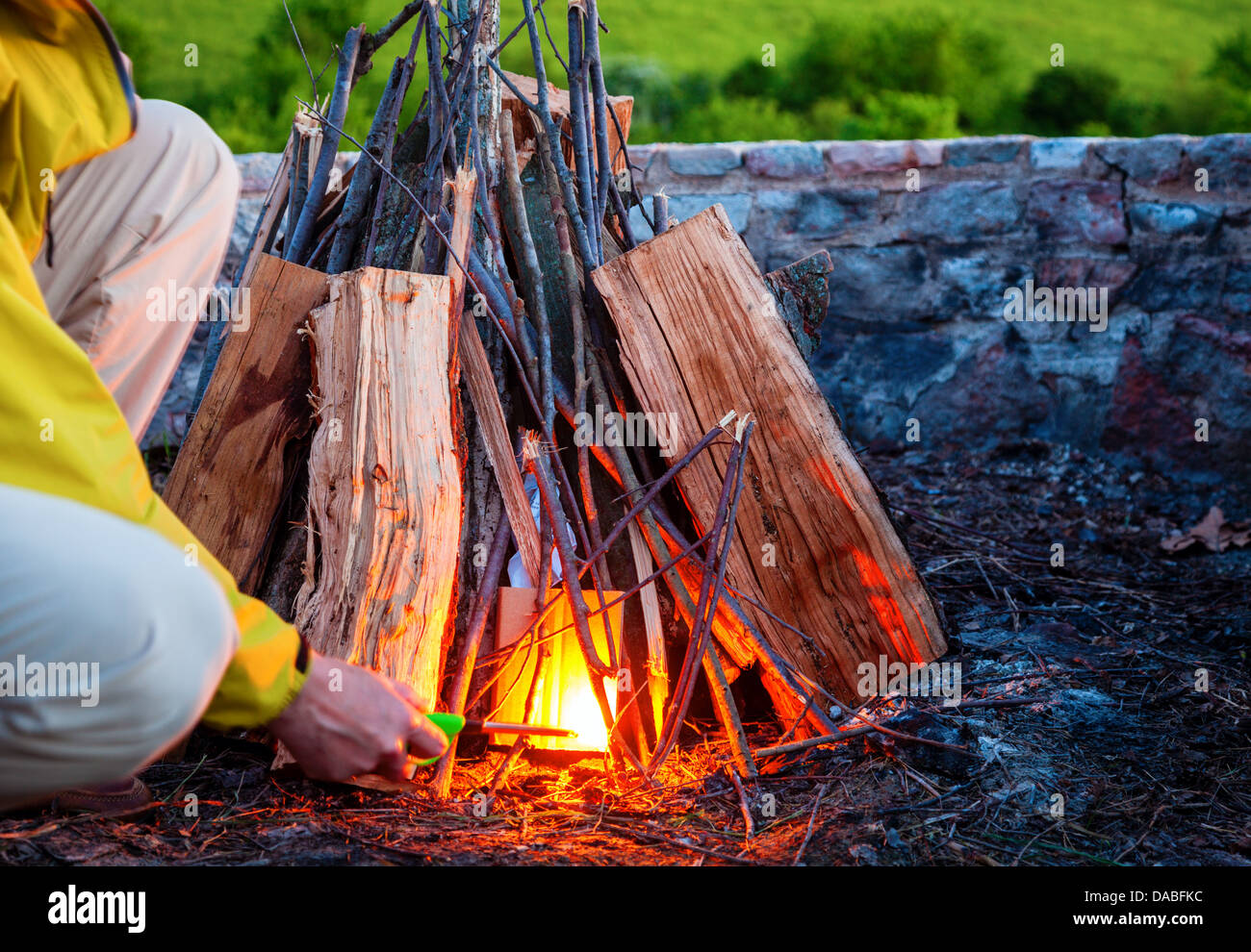 Lighting fire outdoors hi-res stock photography and images - Alamy
