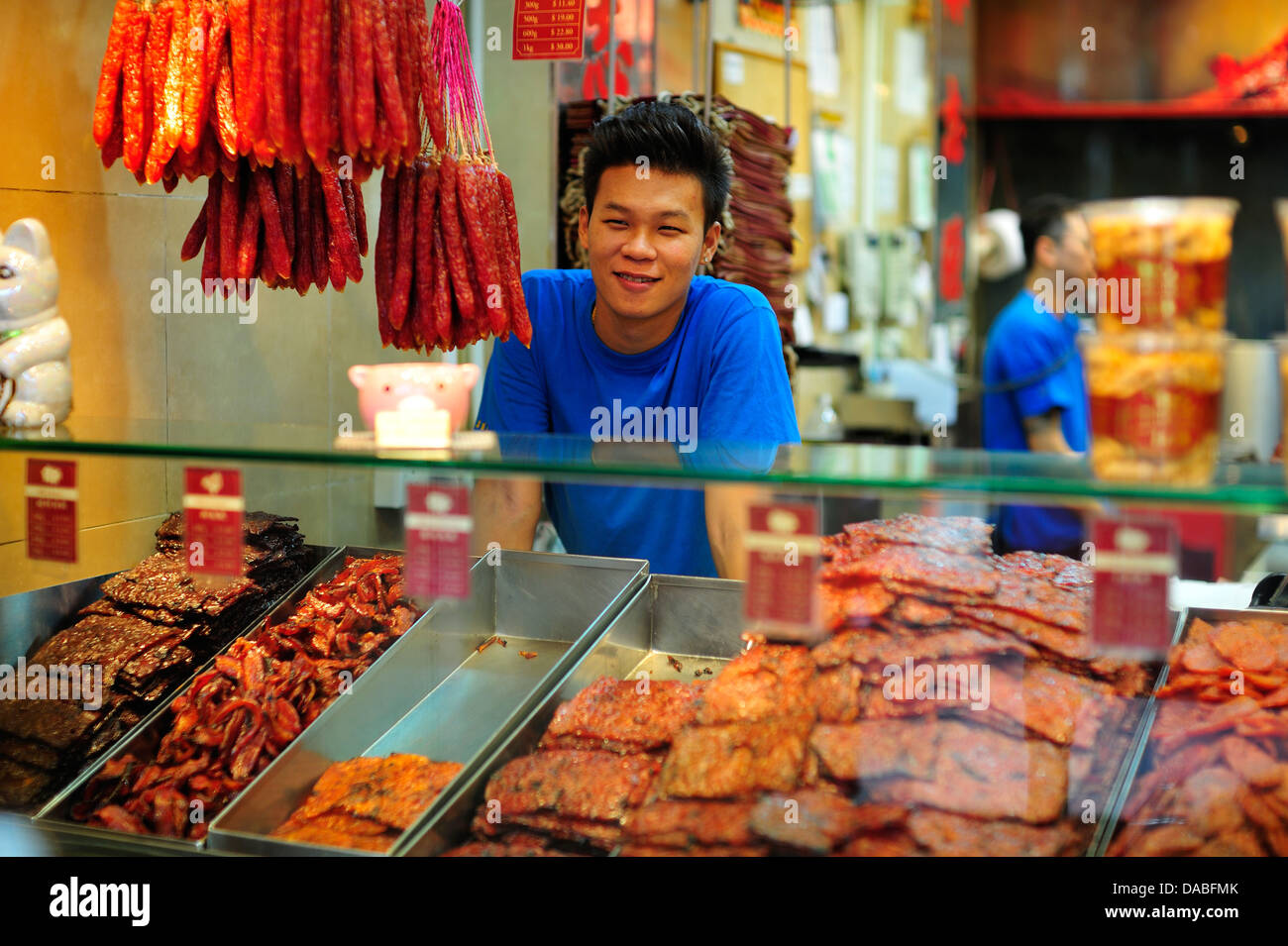 Chinese Cooked Pork Salesman Singapore Stock Photo - Alamy