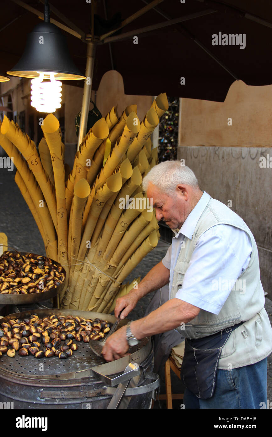 Man selling roasted chestnuts hi-res stock photography and images - Alamy