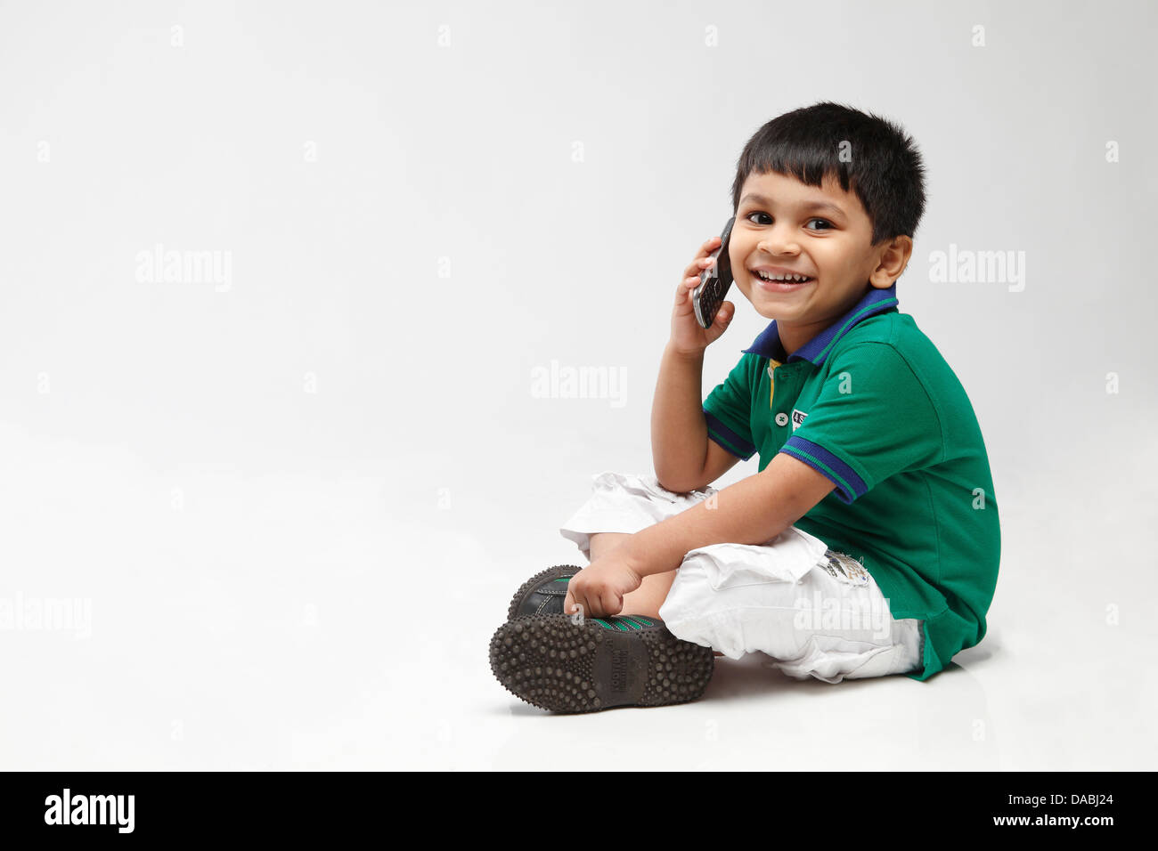 Little 5 year old Indian kid talking on mobile Stock Photo - Alamy