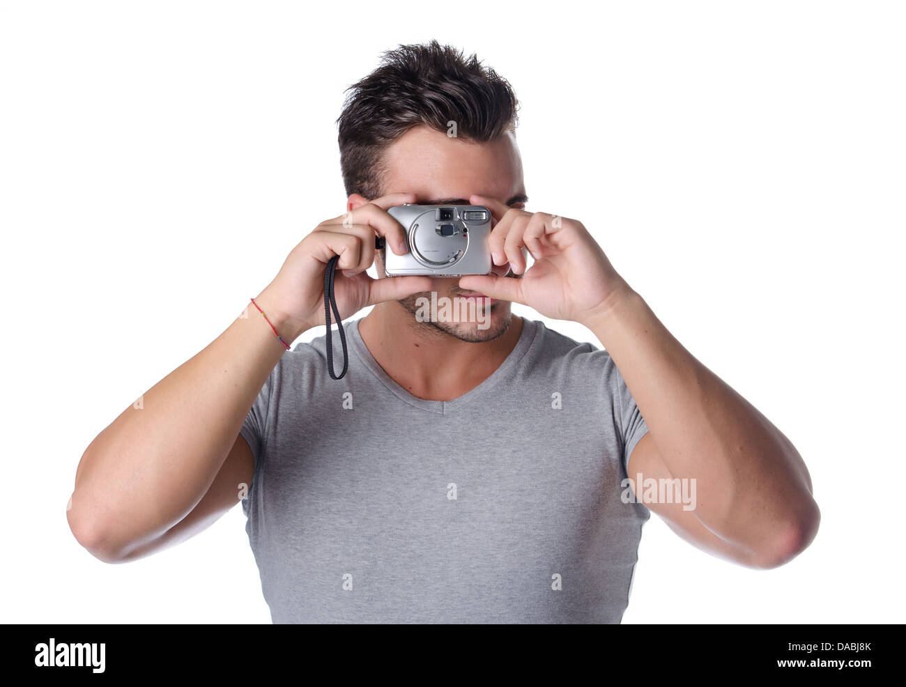 Attractive young man taking picture with compact photo camera Stock ...