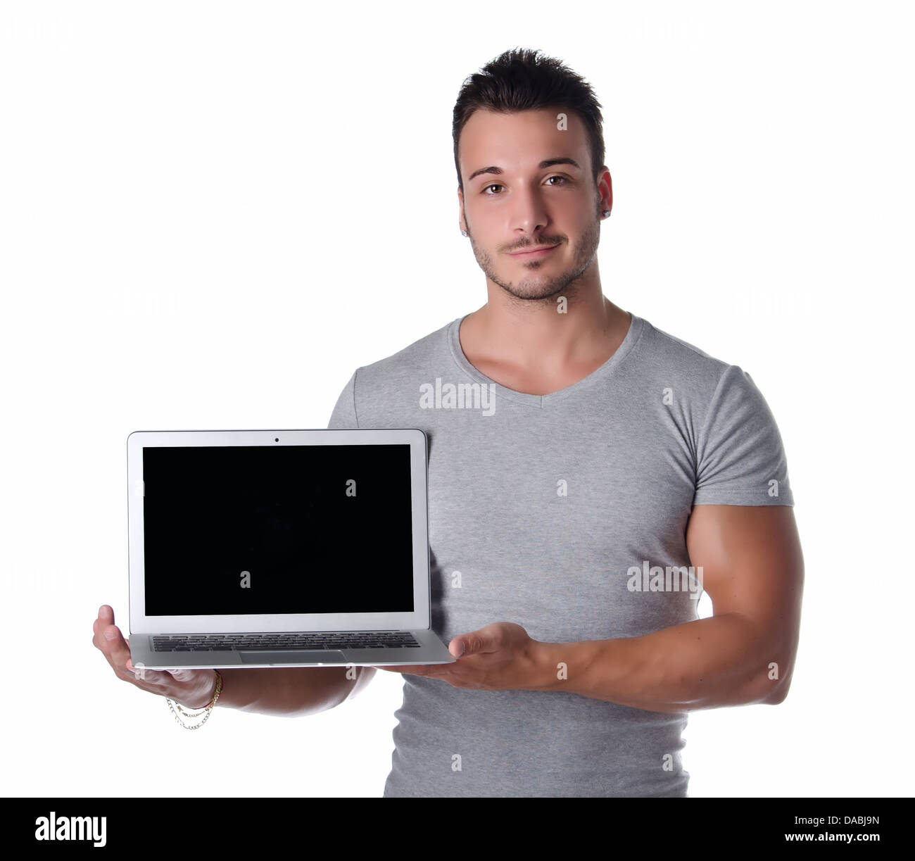Muscular man holding laptop hi-res stock photography and images - Alamy