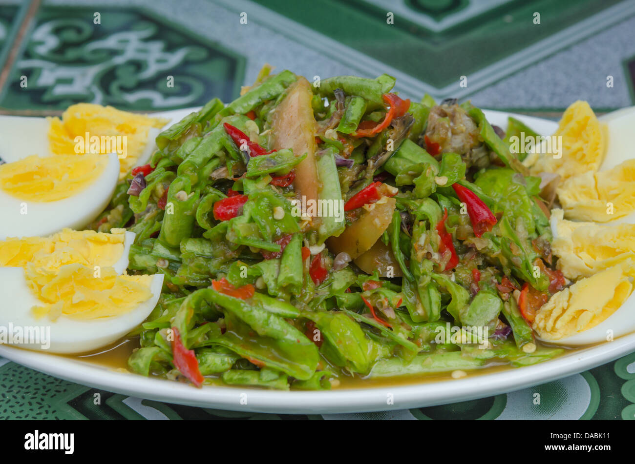 close up String bean spicy salad on plate served boiled egg , asian ...