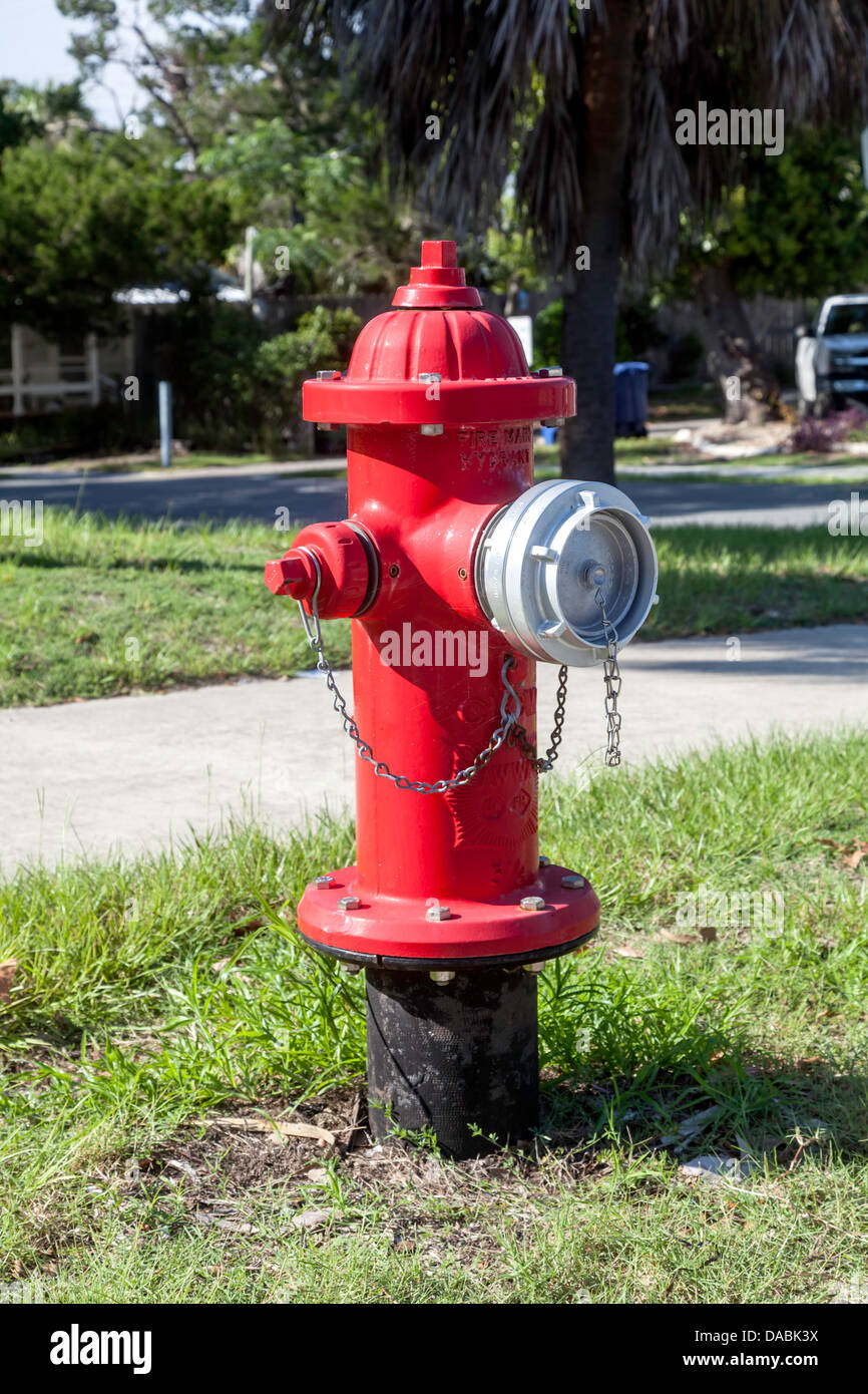 Red curbside fire hydrant Stock Photo - Alamy