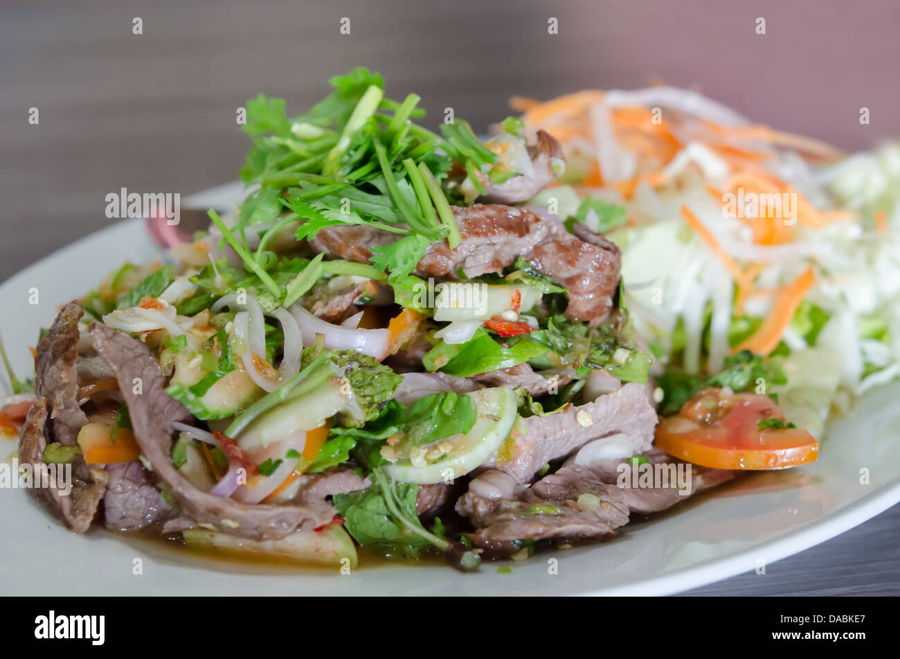 Spicy salad of roasted beef , Thai style cuisine Stock Photo - Alamy