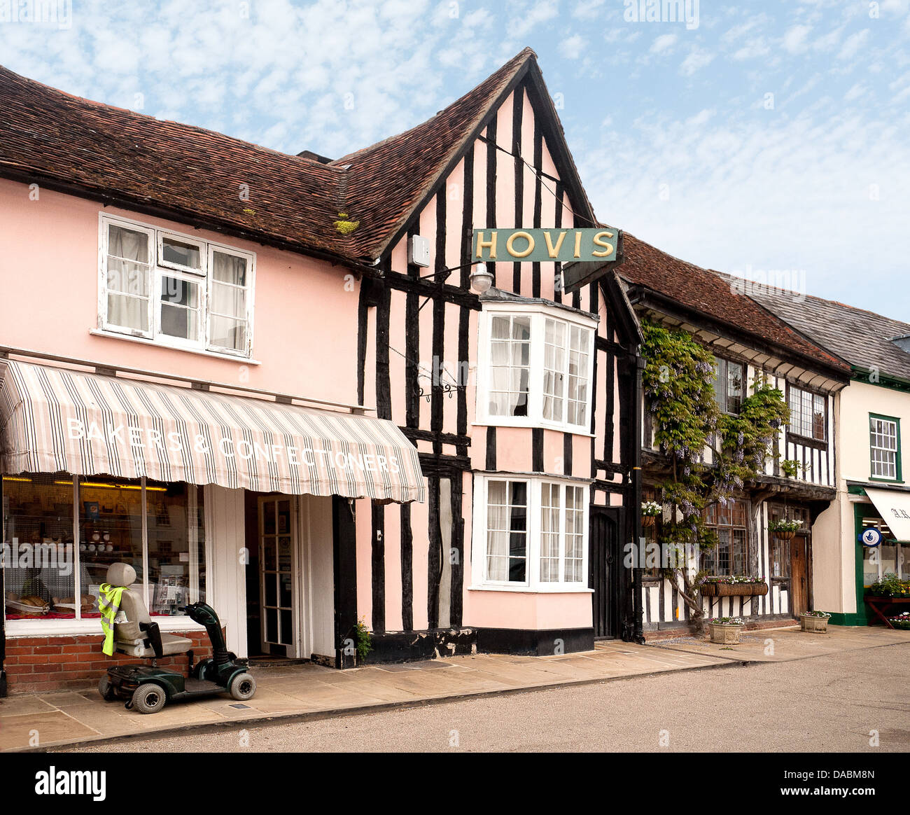 Half-timbered wooden shops and houses in the medieval village Lavenham ...