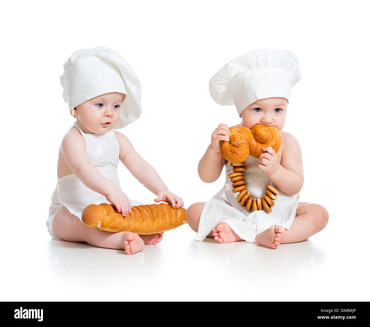 Little bakers babies boy and girl isolated Stock Photo - Alamy