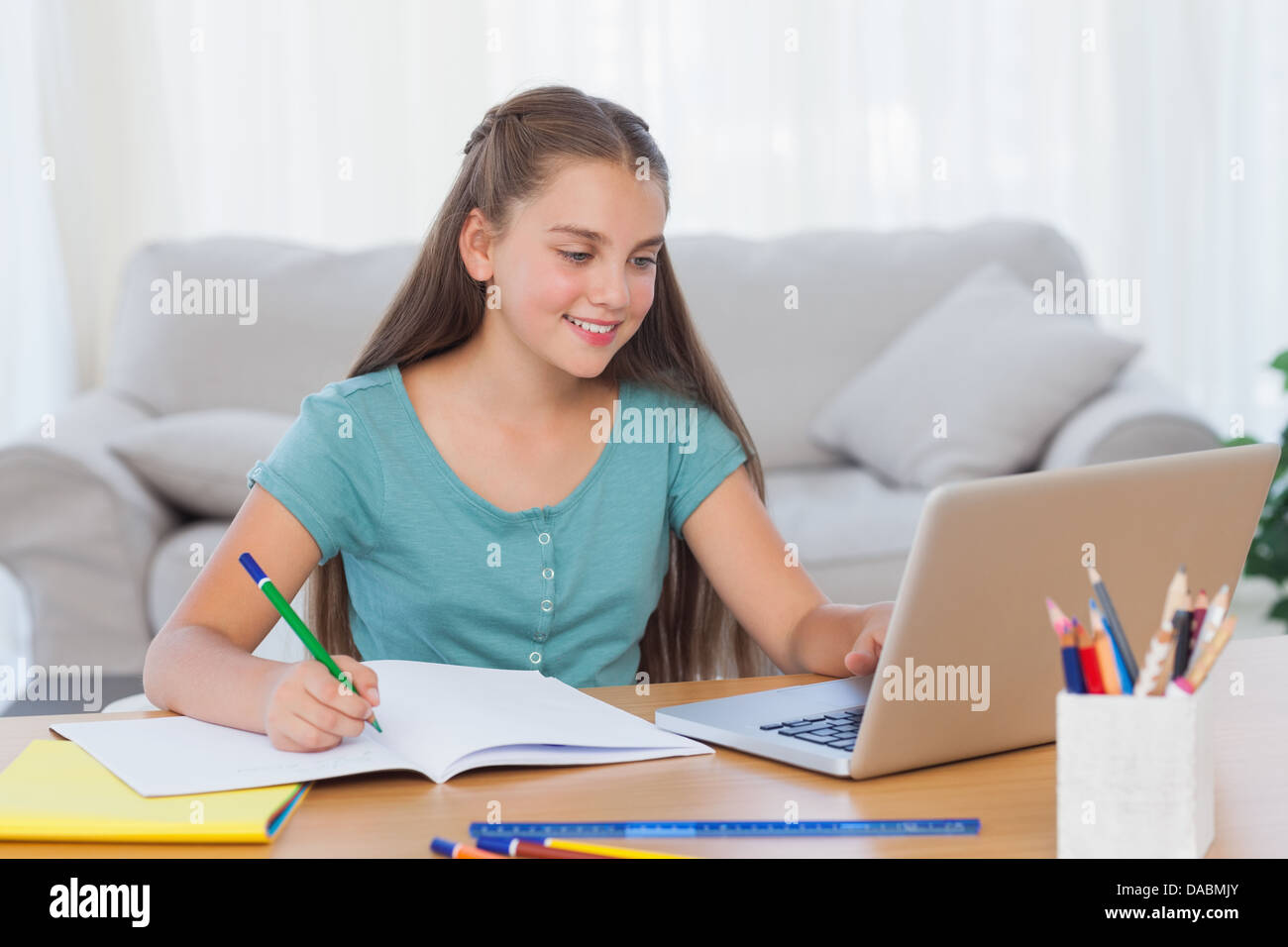 Little girl doing her homework at home Stock Photo - Alamy