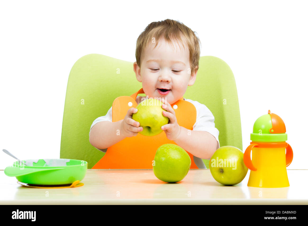 cute baby boy eating apple Stock Photo - Alamy