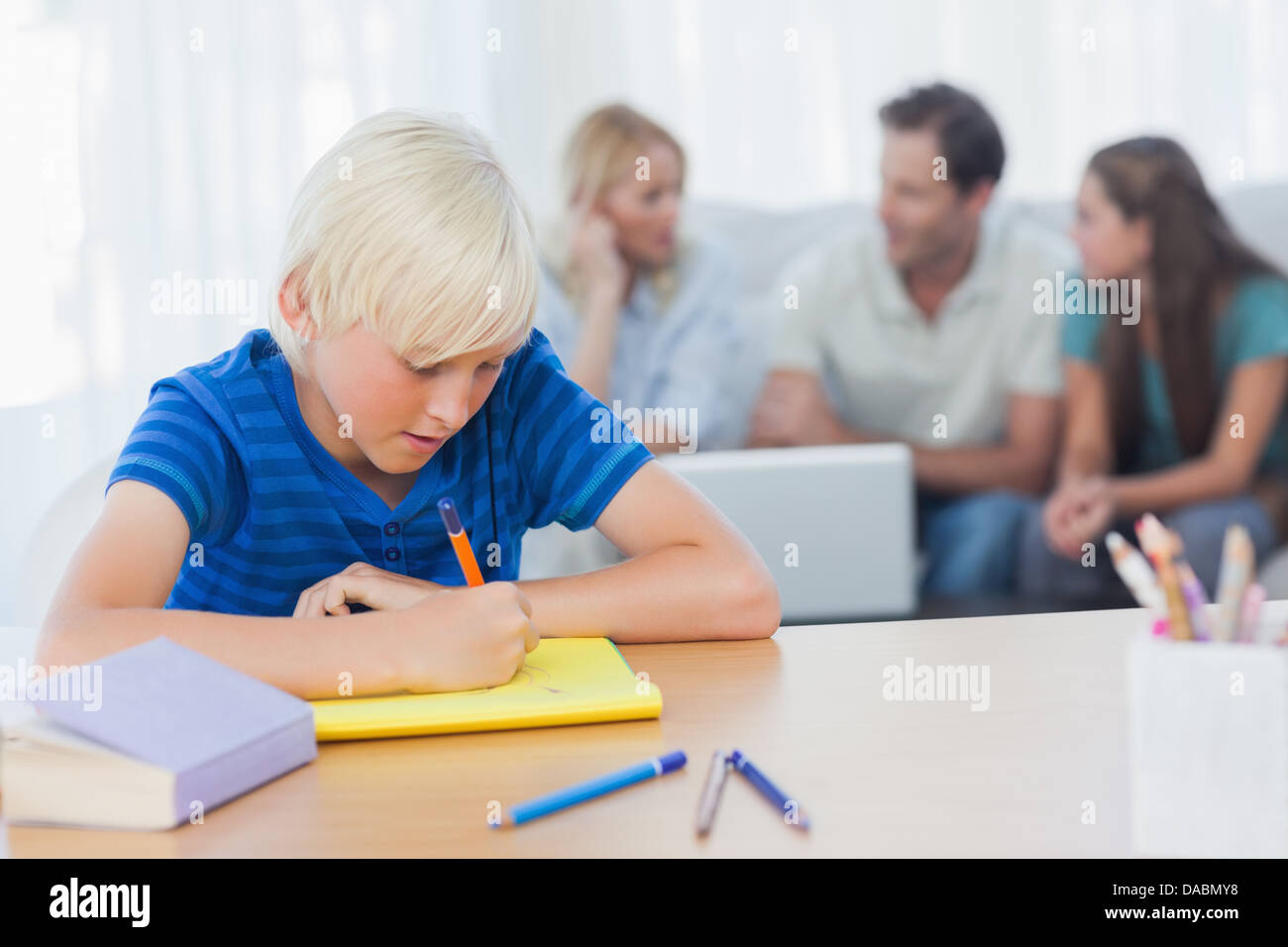 Son doing his homework Stock Photo - Alamy