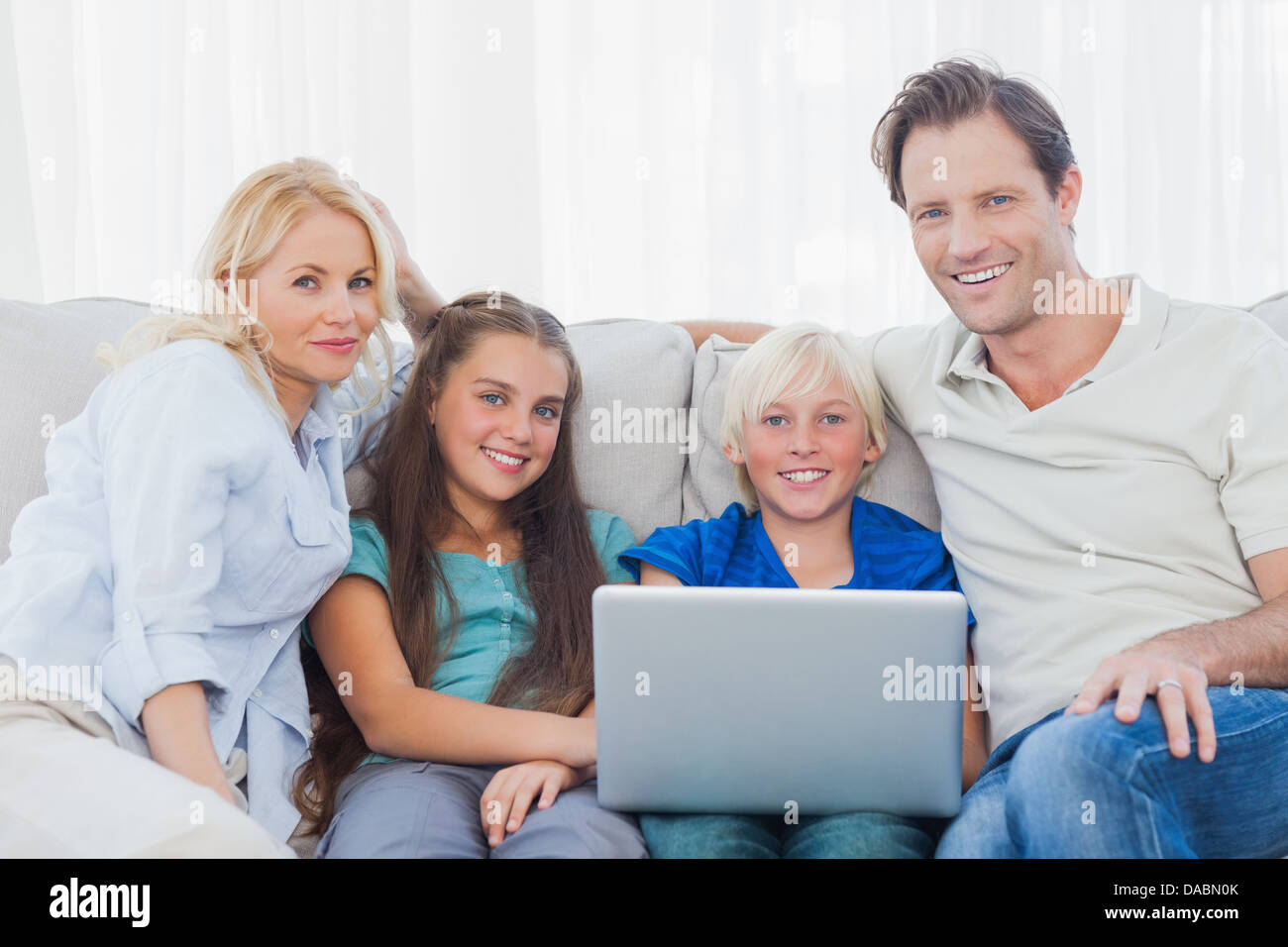 Family using a laptop together Stock Photo - Alamy