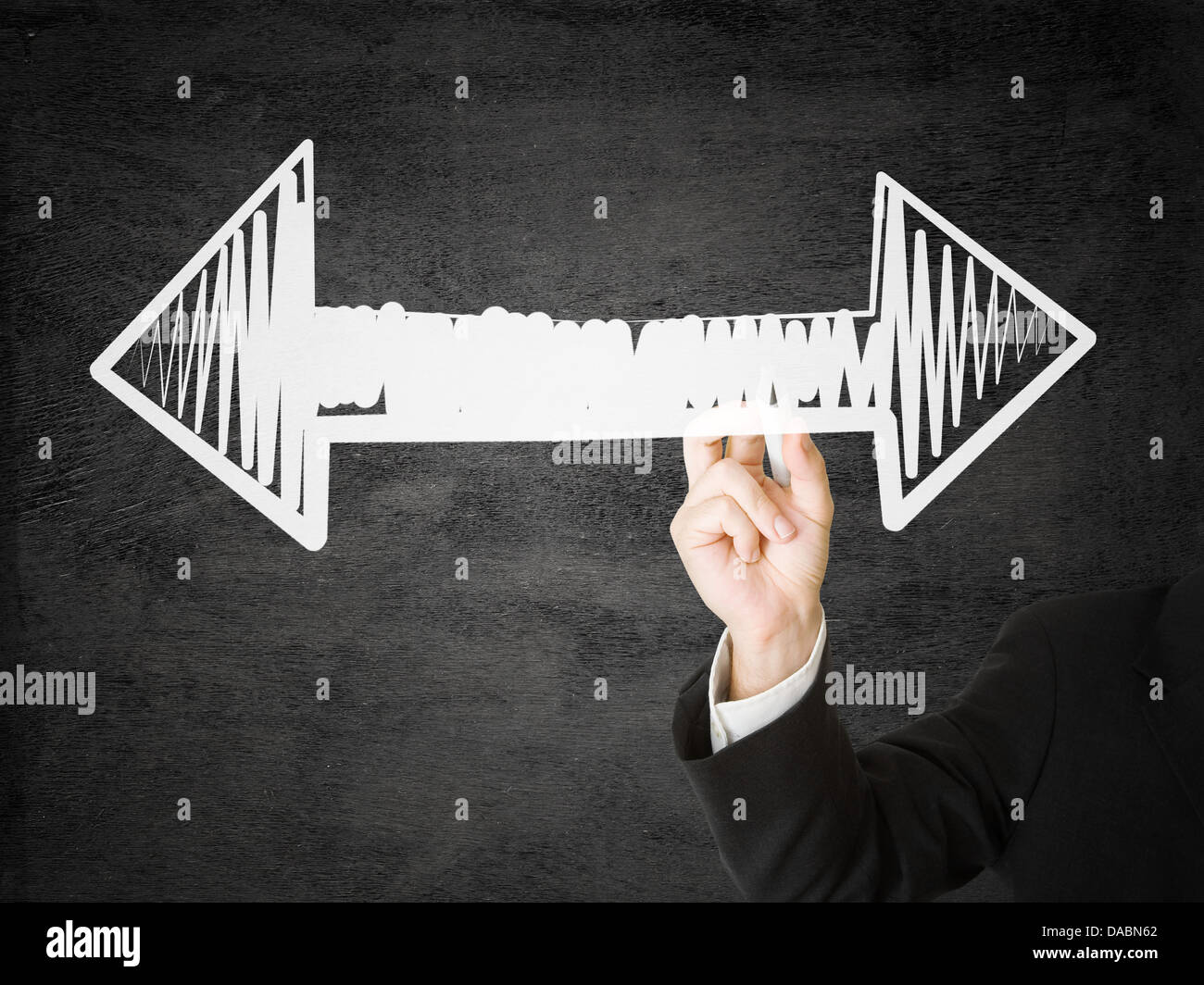 Businessman with pen drawing arrows pointing left and right - decision ...