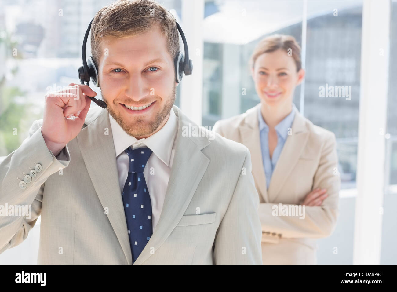 Handsome call centre agent with colleague behind him Stock Photo - Alamy Handsome call centre agent with colleague behind him Stock Photo - Alamy