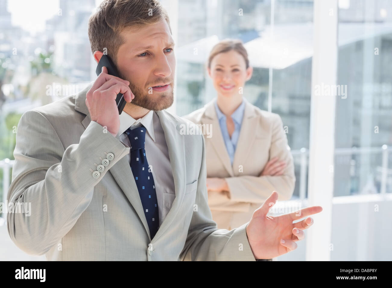 Businessman having phone conversation Stock Photo - Alamy