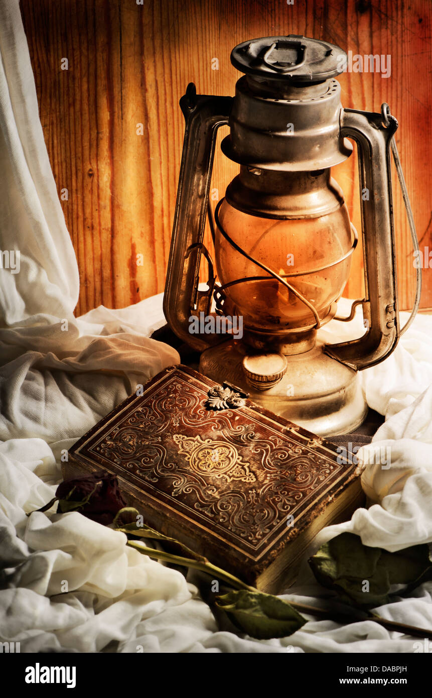 Still life lantern old book hi-res stock photography and images - Alamy