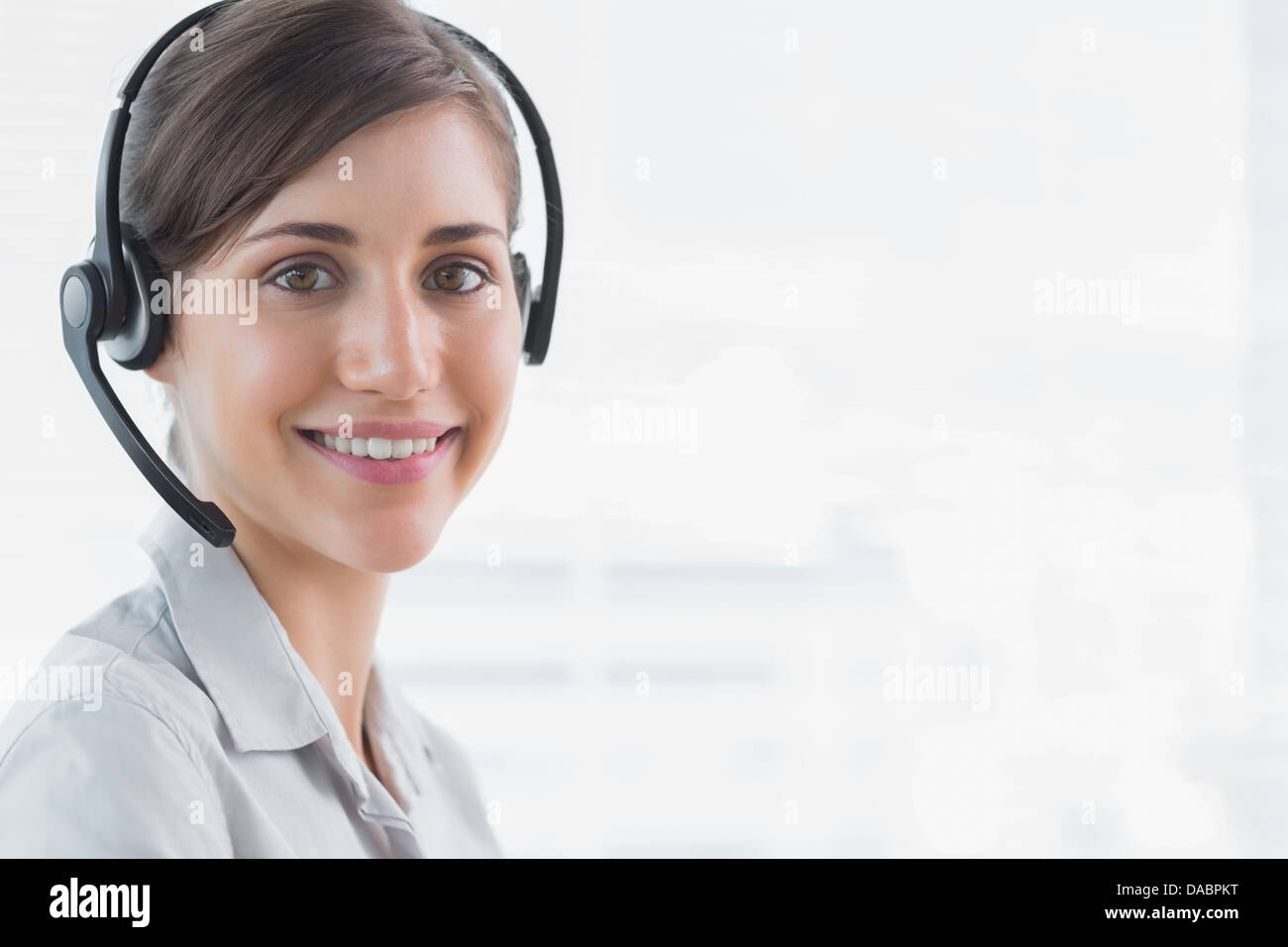 Call centre agent smiling camera hi-res stock photography and images ...