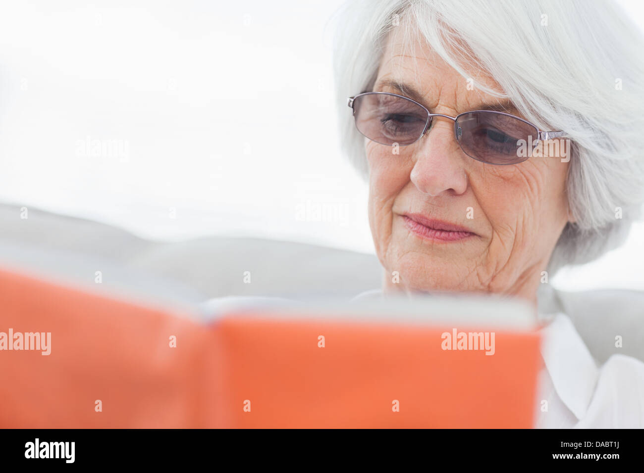 Portrait of a woman reading a book Stock Photo - Alamy