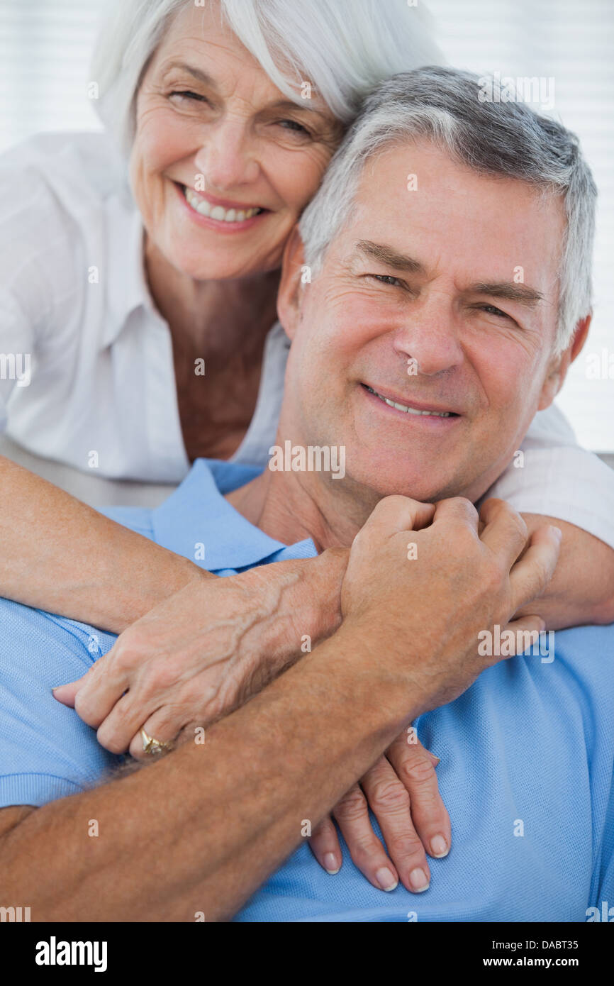 Portrait of woman embracing husband Stock Photo - Alamy