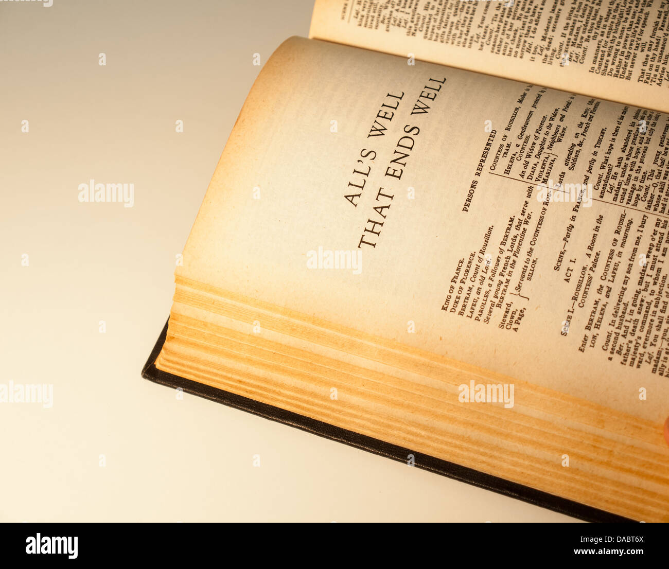 an old aged copy of the complete works of Shakespeare open at all's ...