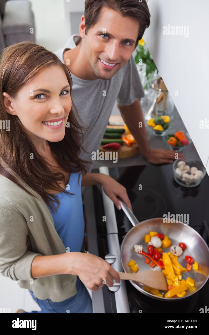 Couple cooking vegetables in the kitchen Stock Photo - Alamy