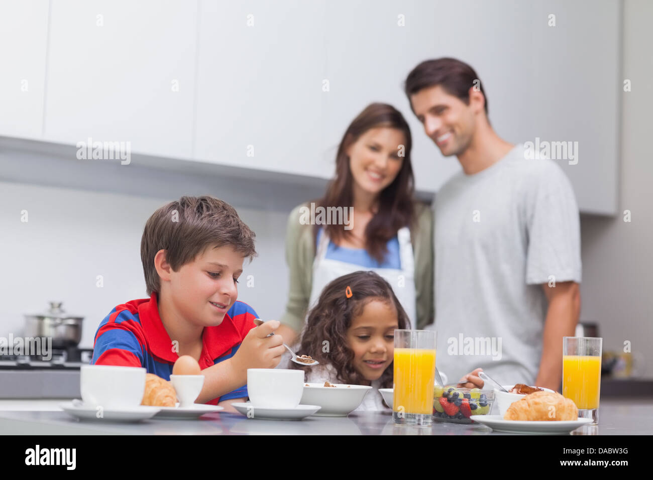 Children eating breakfast cereal hi-res stock photography and images ...