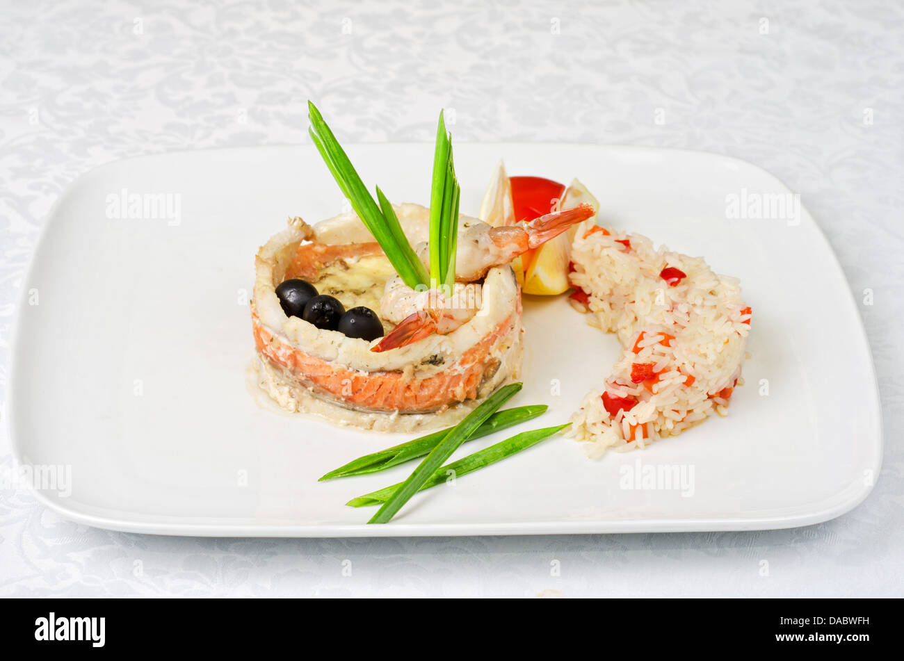 tasty prepared fish with rice and vegetables Stock Photo - Alamy