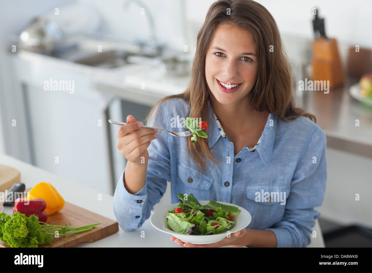Woman eating salad hi-res stock photography and images - Alamy