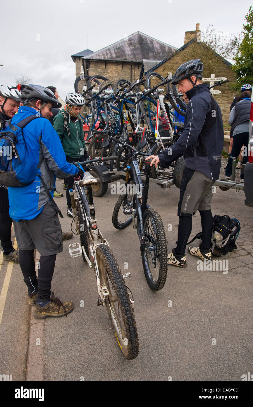 Cyclists taking part in Hay Bike Fest 2013 load their mountain bikes ...