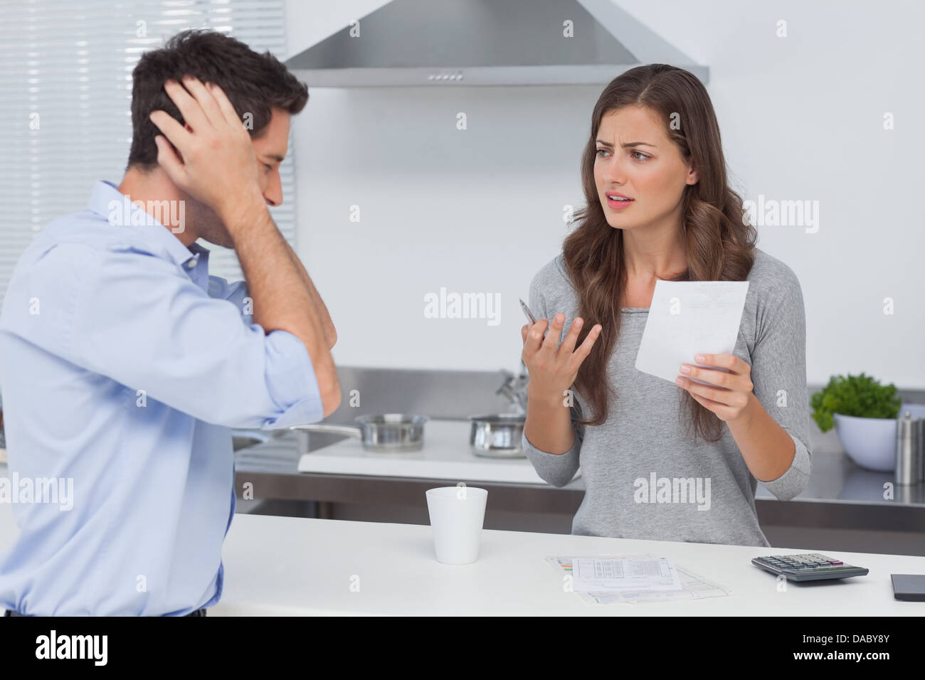 Angry couple doing their accounts Stock Photo - Alamy