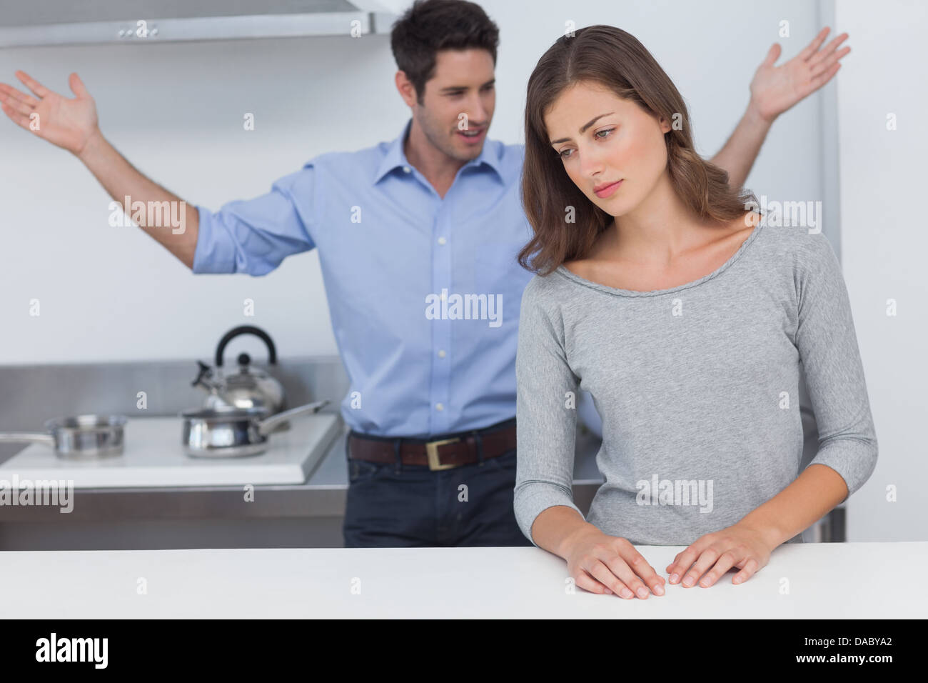 Man gesturing to wife during a dispute Stock Photo - Alamy
