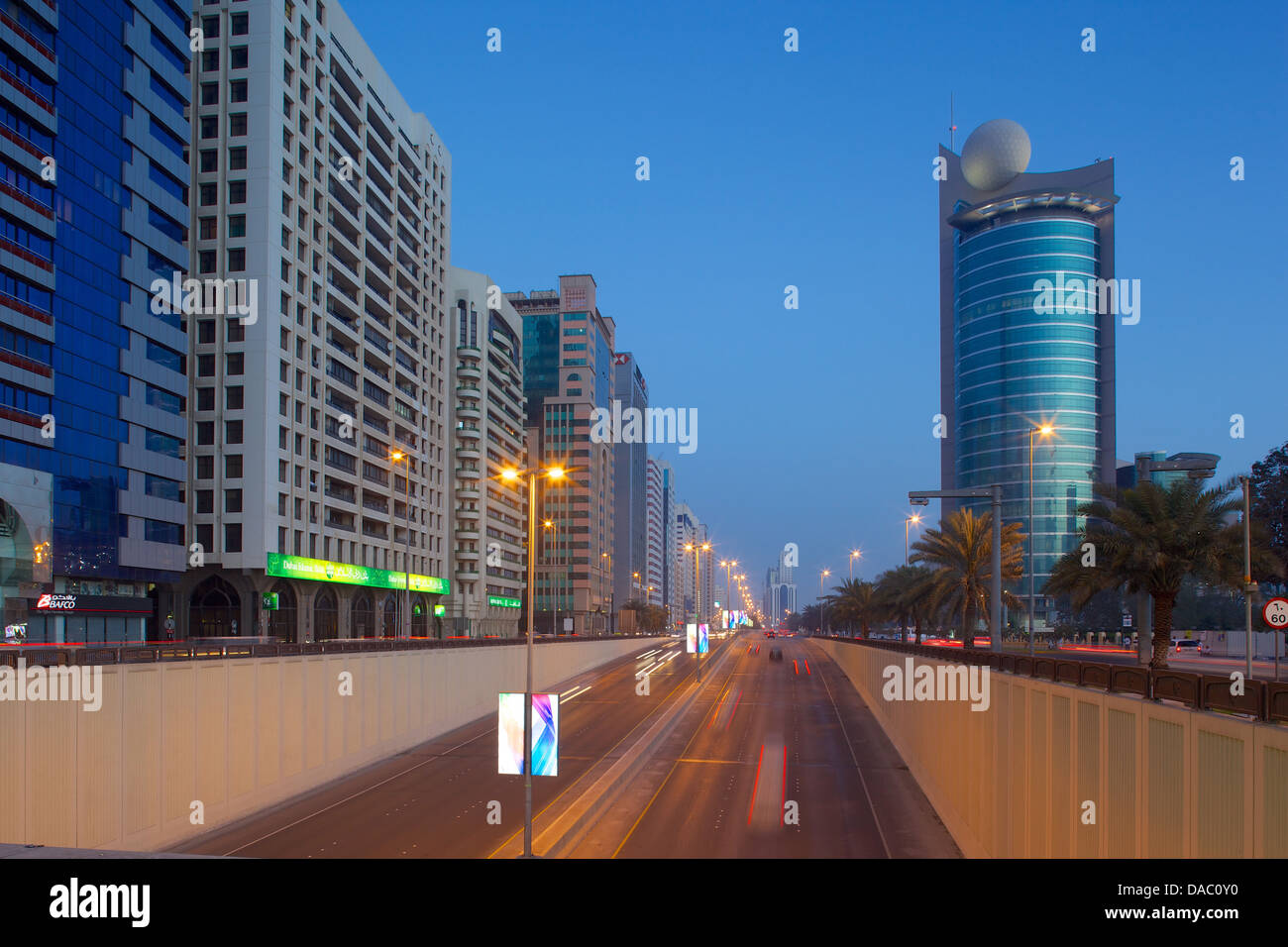 City skyline on Rashid Bin Saeed Al Maktoum Street at dusk, Abu Dhabi ...