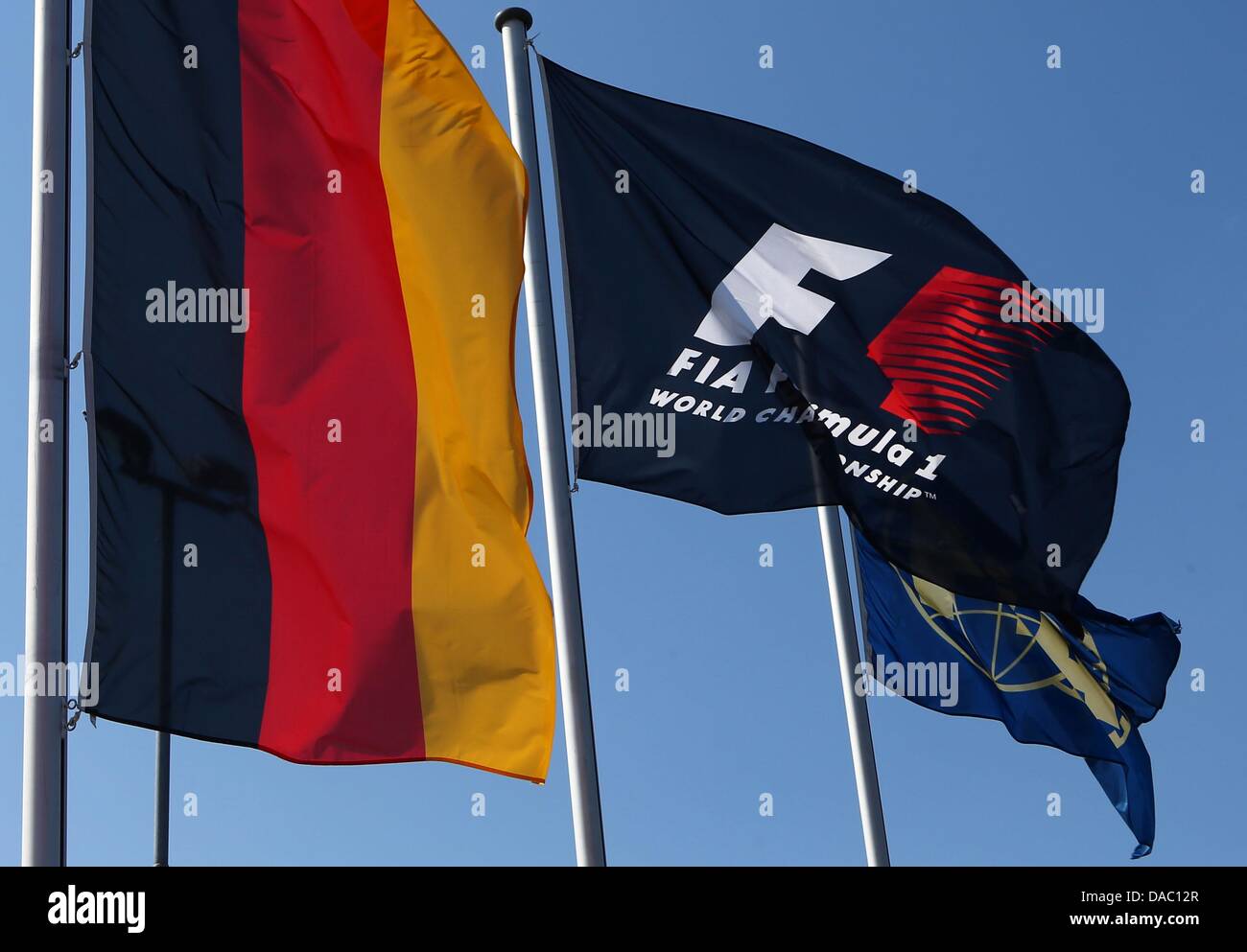 The German flag and the flags of the FIA and the Formula One seen at ...